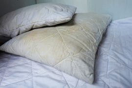 Why Does My Pillow Smell? (4 Causes to Consider) - wigglywisdom.com